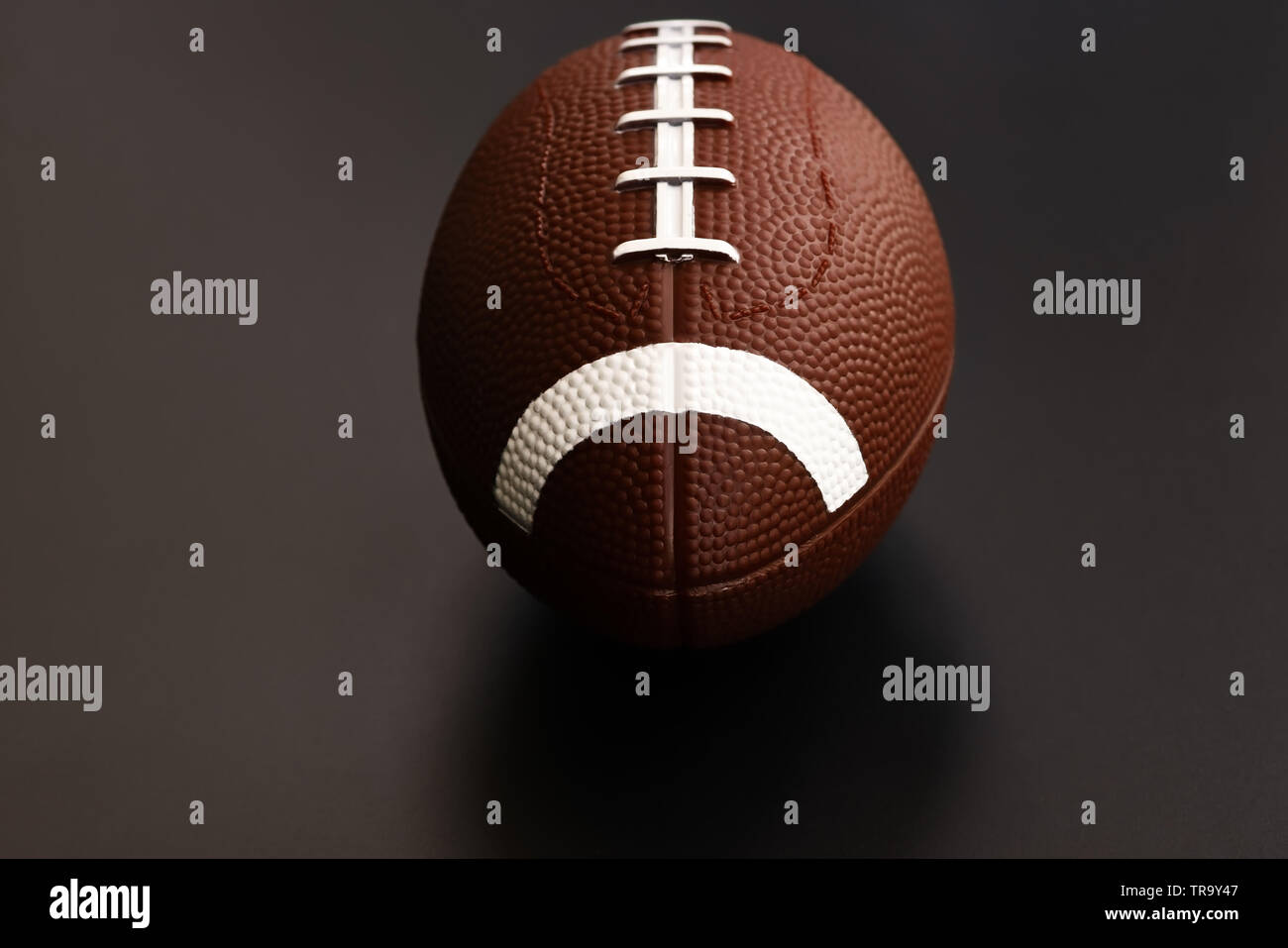 American football isolated on black background . Sport object concept ...
