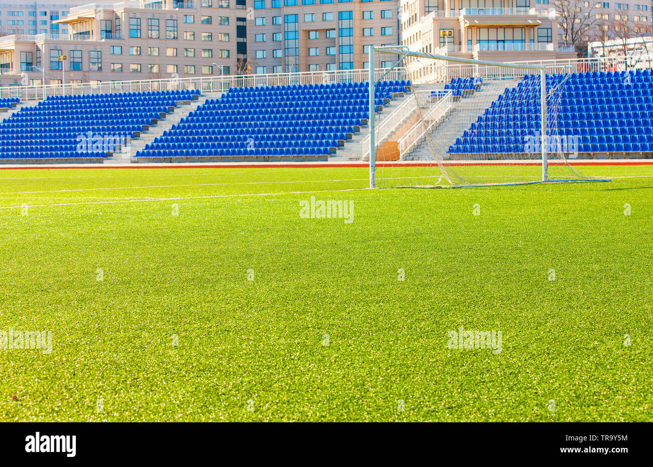 field for game in soccer with a gate and bleachers Stock Photo - Alamy