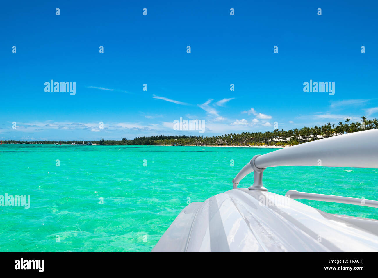 Side view Speeding fishing motor boat with drops of water. Blue ocean ...