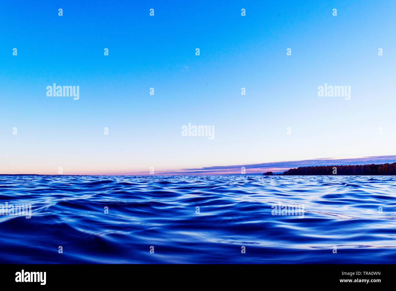 Water surface. View of a Sunset sky background. Dramatic gold sunset ...