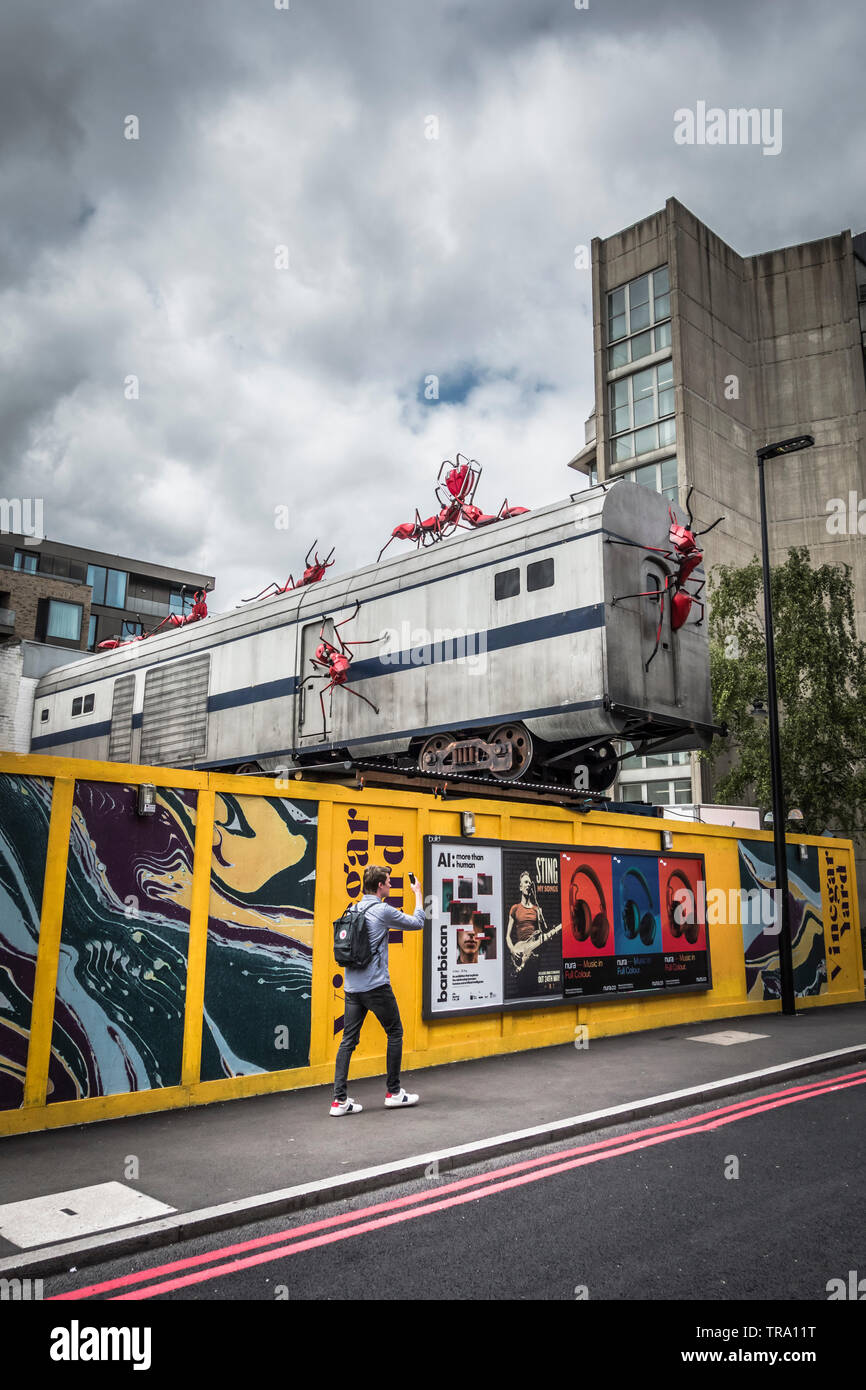 Train carriage and giant red ants installation at Vinegar Yard, St ...