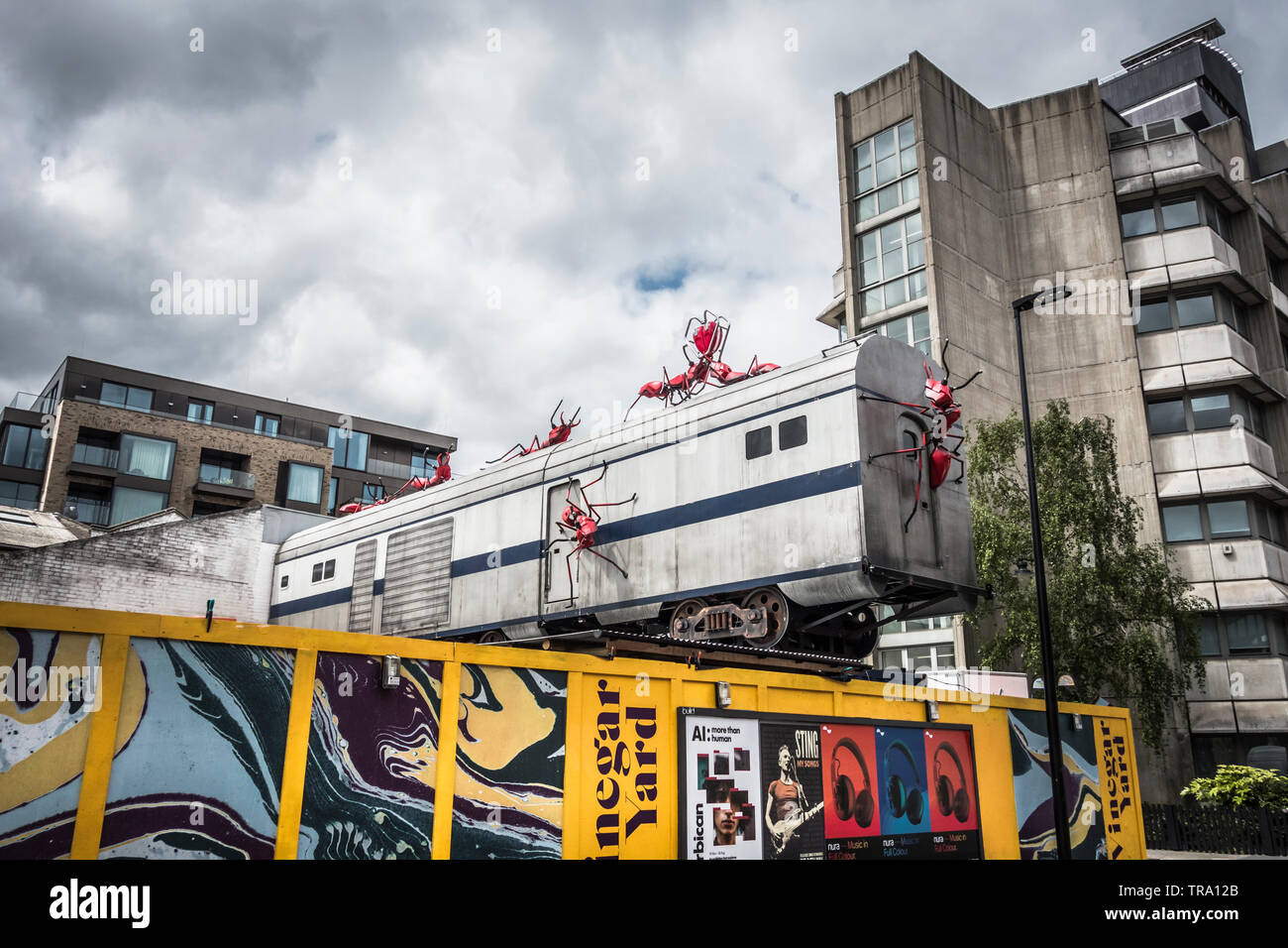 Train carriage and giant red ants installation at Vinegar Yard, St ...