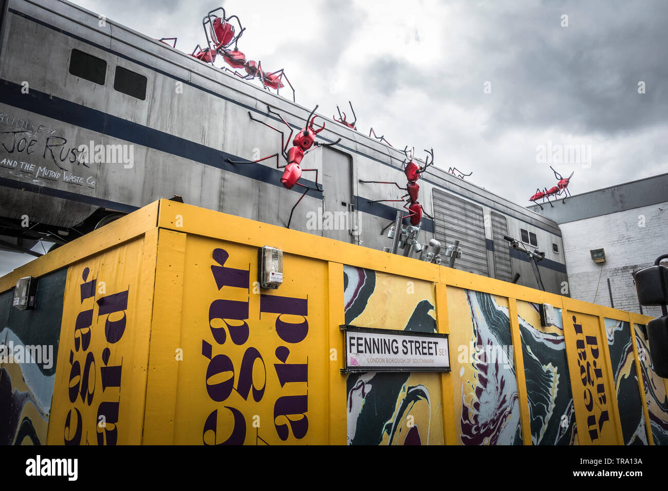 Train carriage and giant red ants installation at Vinegar Yard, St ...