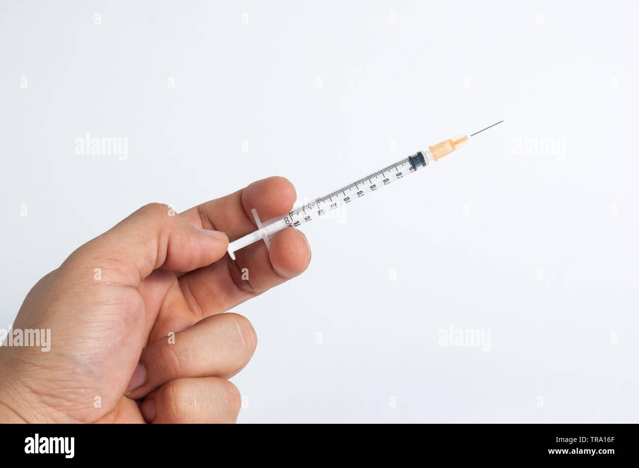 Close up hand hold injection needle isolated on white background Stock ...