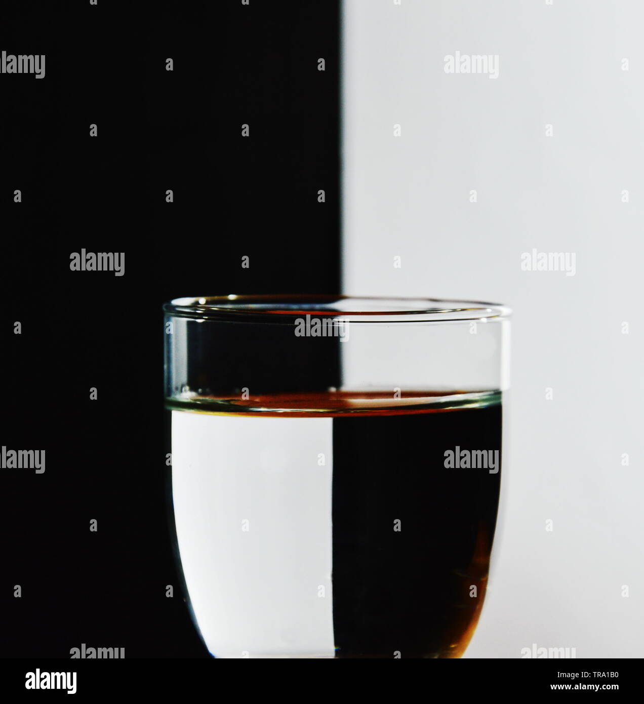 refraction on glass water in black and white background Stock Photo - Alamy