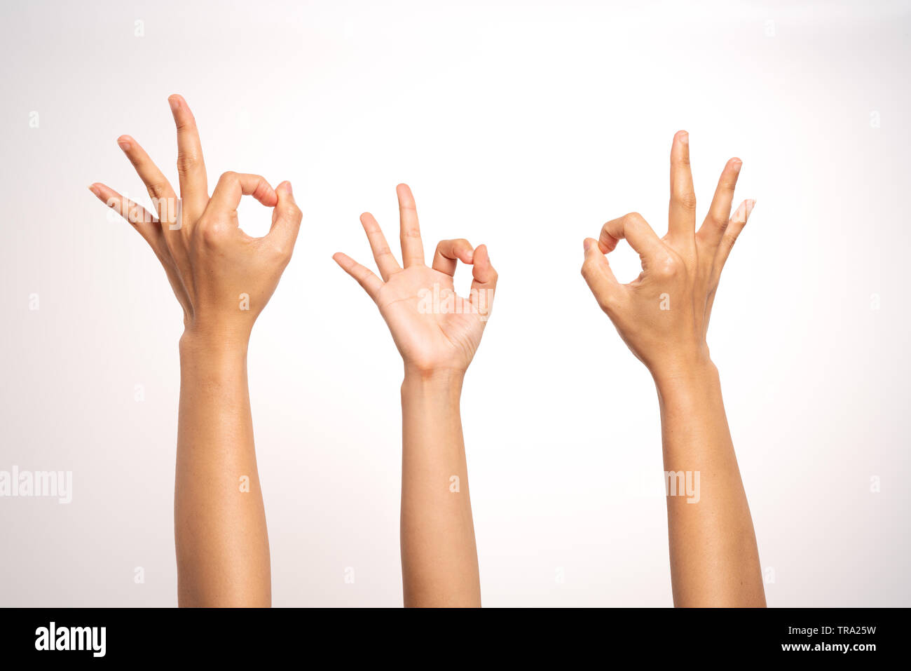 women hand OK sign gesturing on white background in three action Stock ...