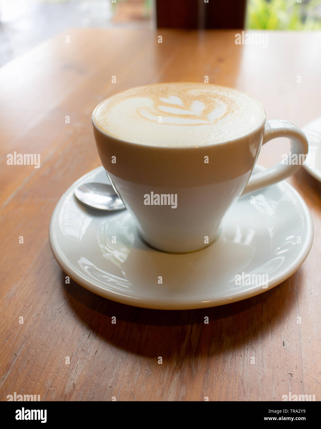 Cappuccino love on glass table hi-res stock photography and images - Alamy