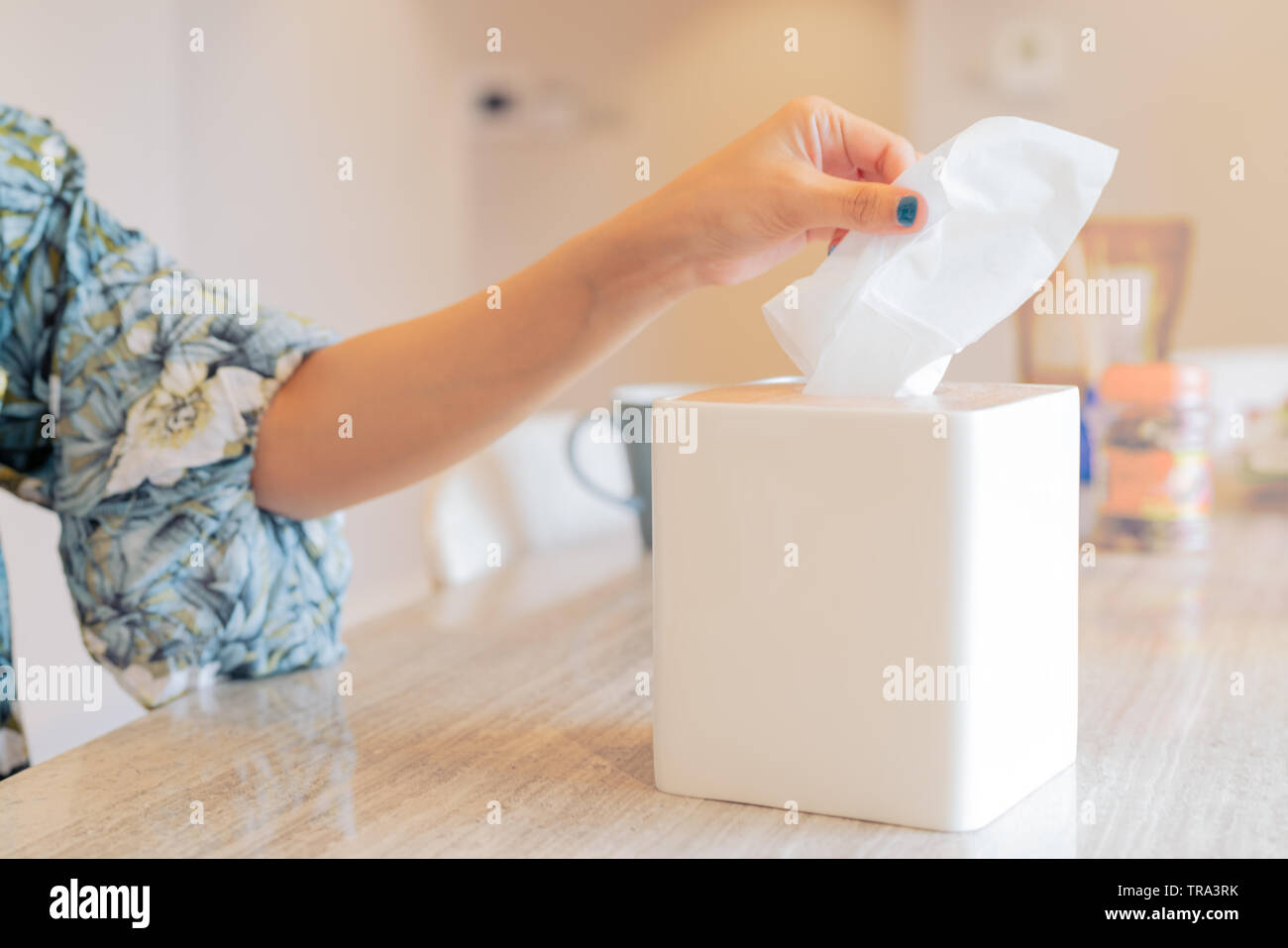 women hand picking napkin/tissue paper from the tissue box Stock Photo ...