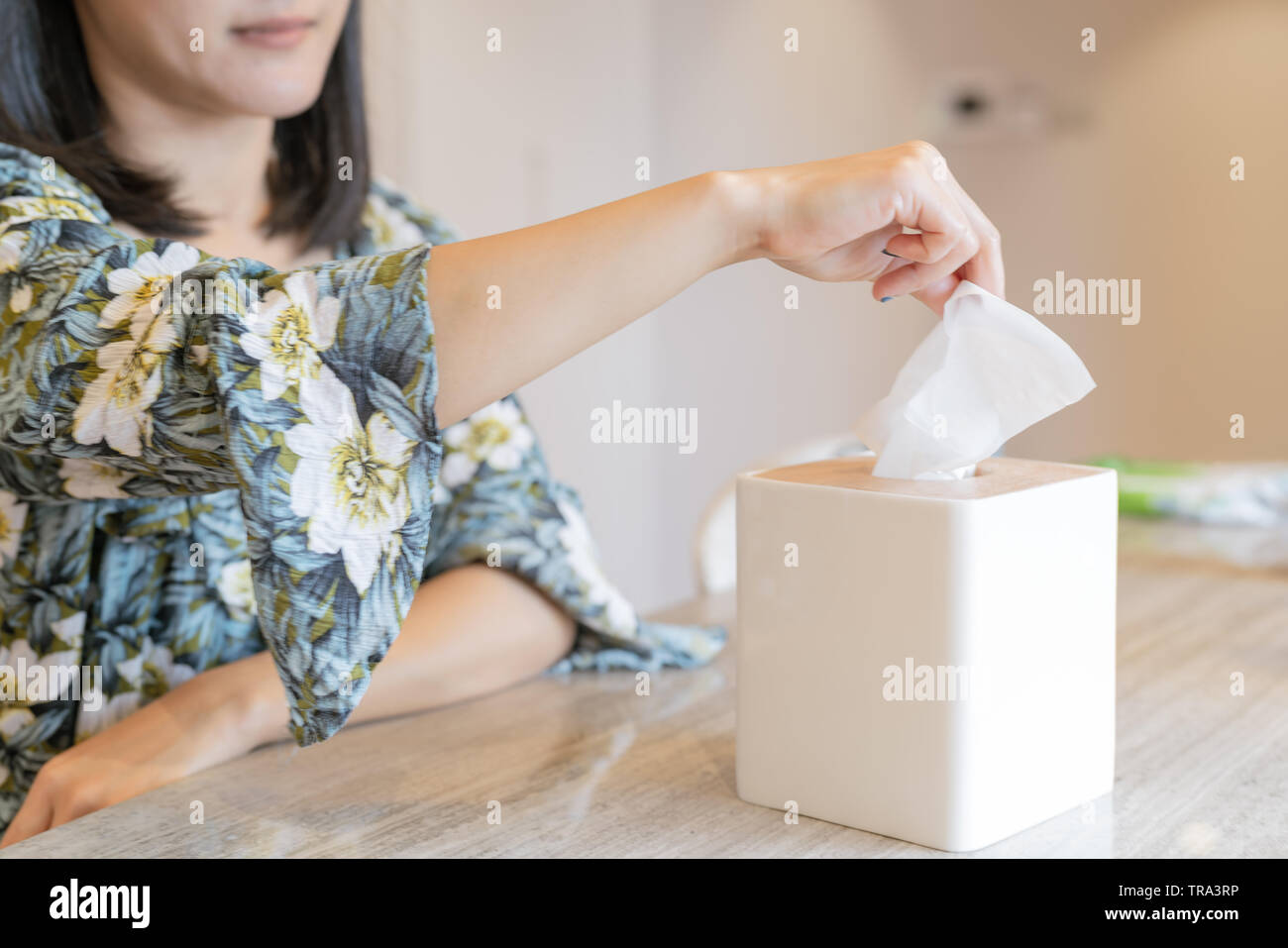 women hand picking napkin/tissue paper from the tissue box Stock Photo ...