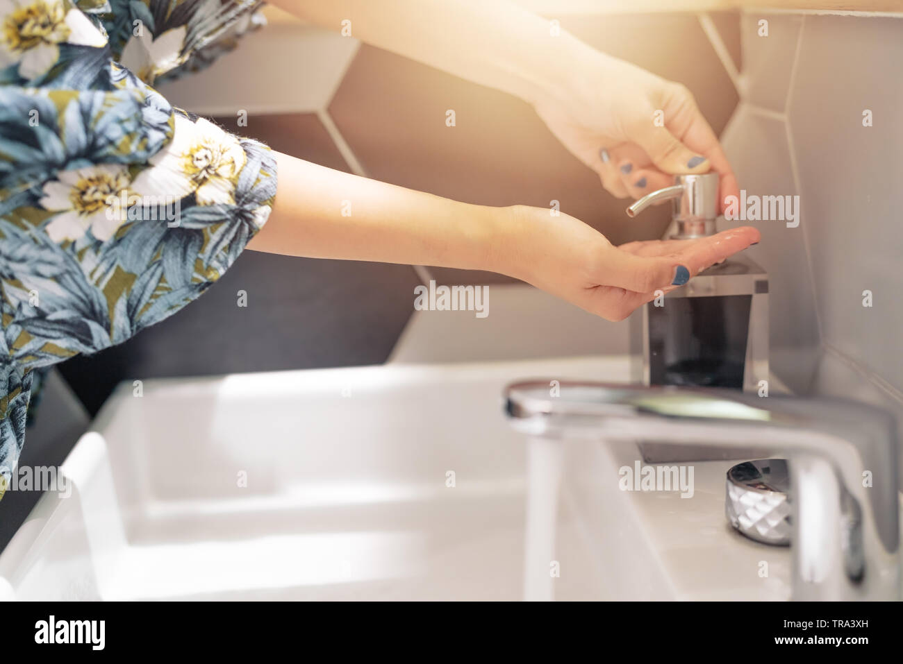 women washing hand with liquid soap in restroom Stock Photo - Alamy