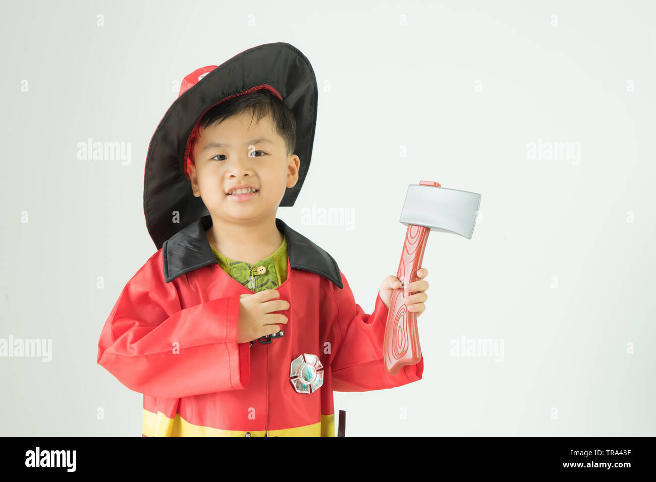 Children wearing fire extinguishers holding axe on white background ...