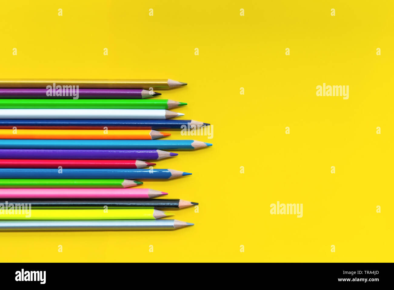Teamwork concept. group of color pencil on yellow background with word ...