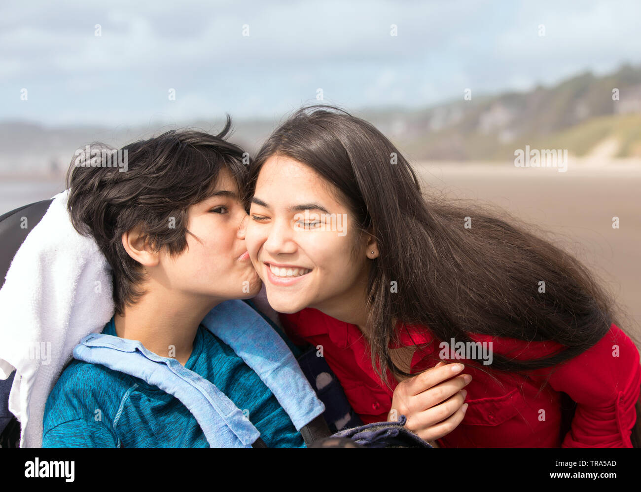 Older brother kissing sister hi-res stock photography and images - Alamy
