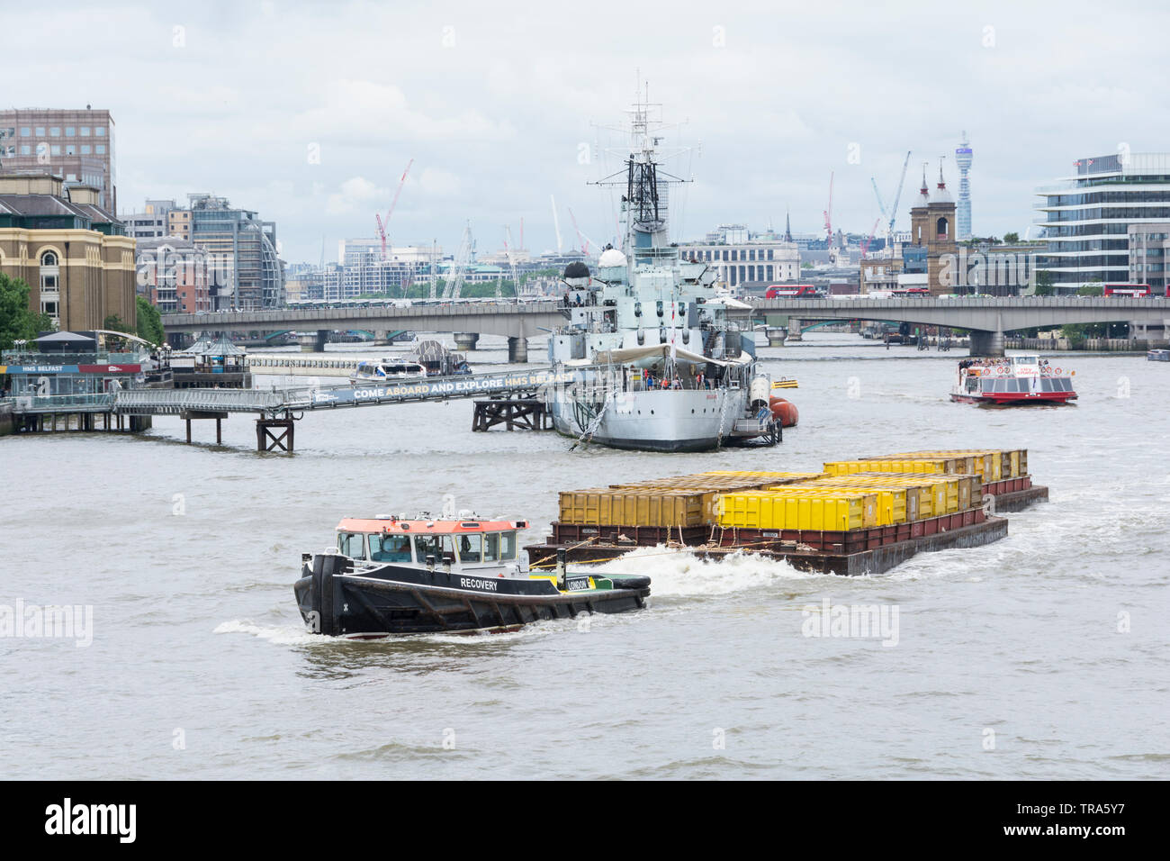 Cory tugboat Recovery transporting sealed containers along the River ...