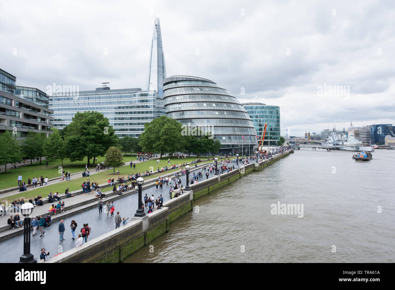 Tourists enjoying views of Norman Foster's London City Hall on the ...