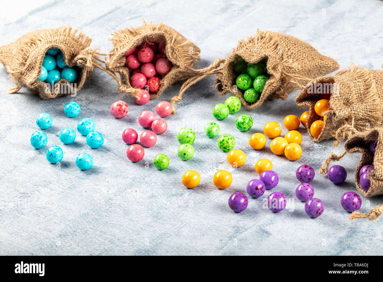 Roasted chickpeas covered in chocolate, fruit sauce. colorful candies ...