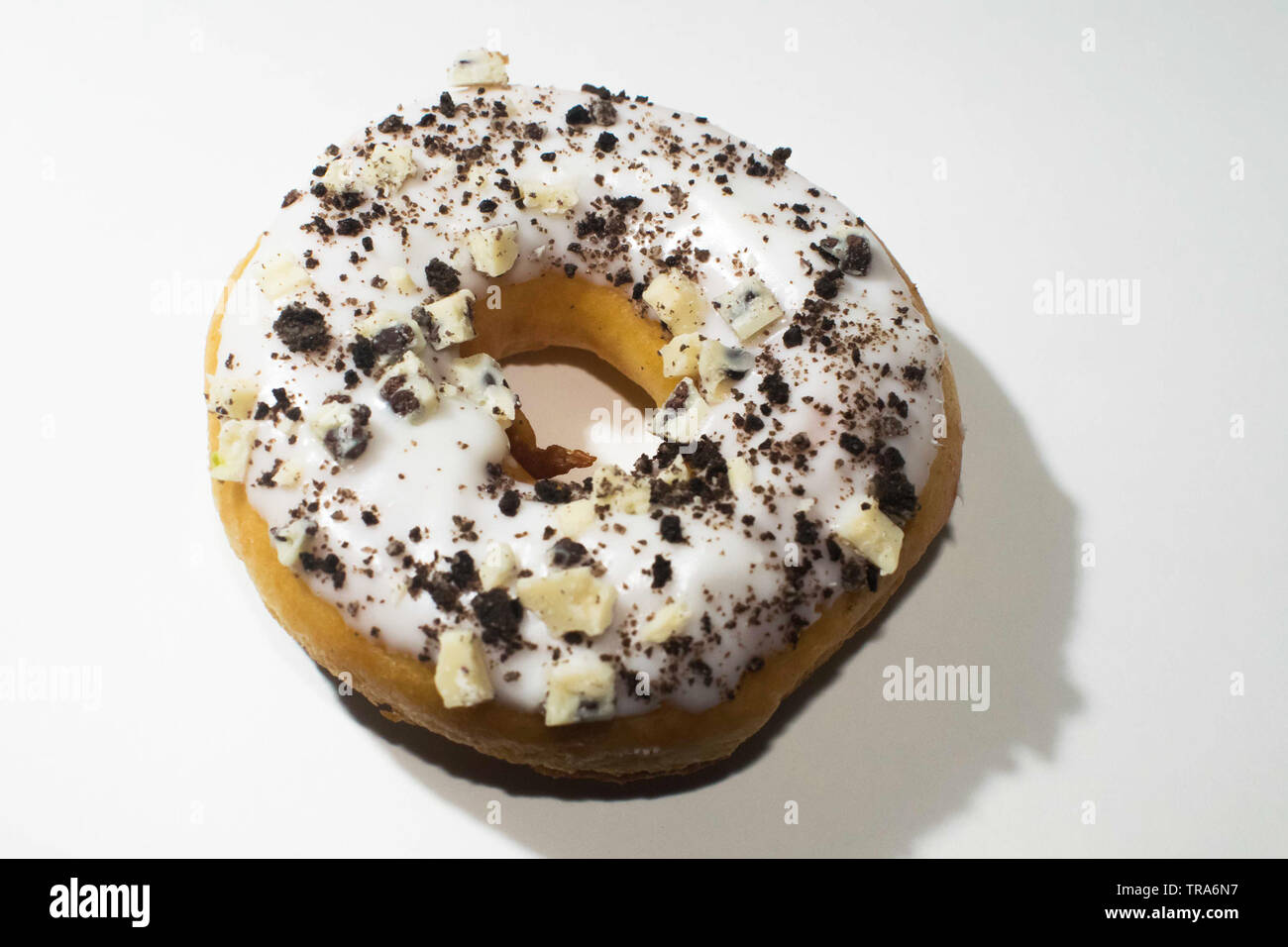 Frosted white doughnut on a white background Stock Photo - Alamy