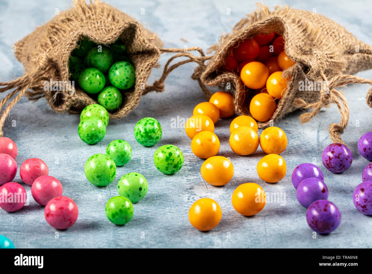 Roasted chickpeas covered in chocolate, fruit sauce. colorful candies ...
