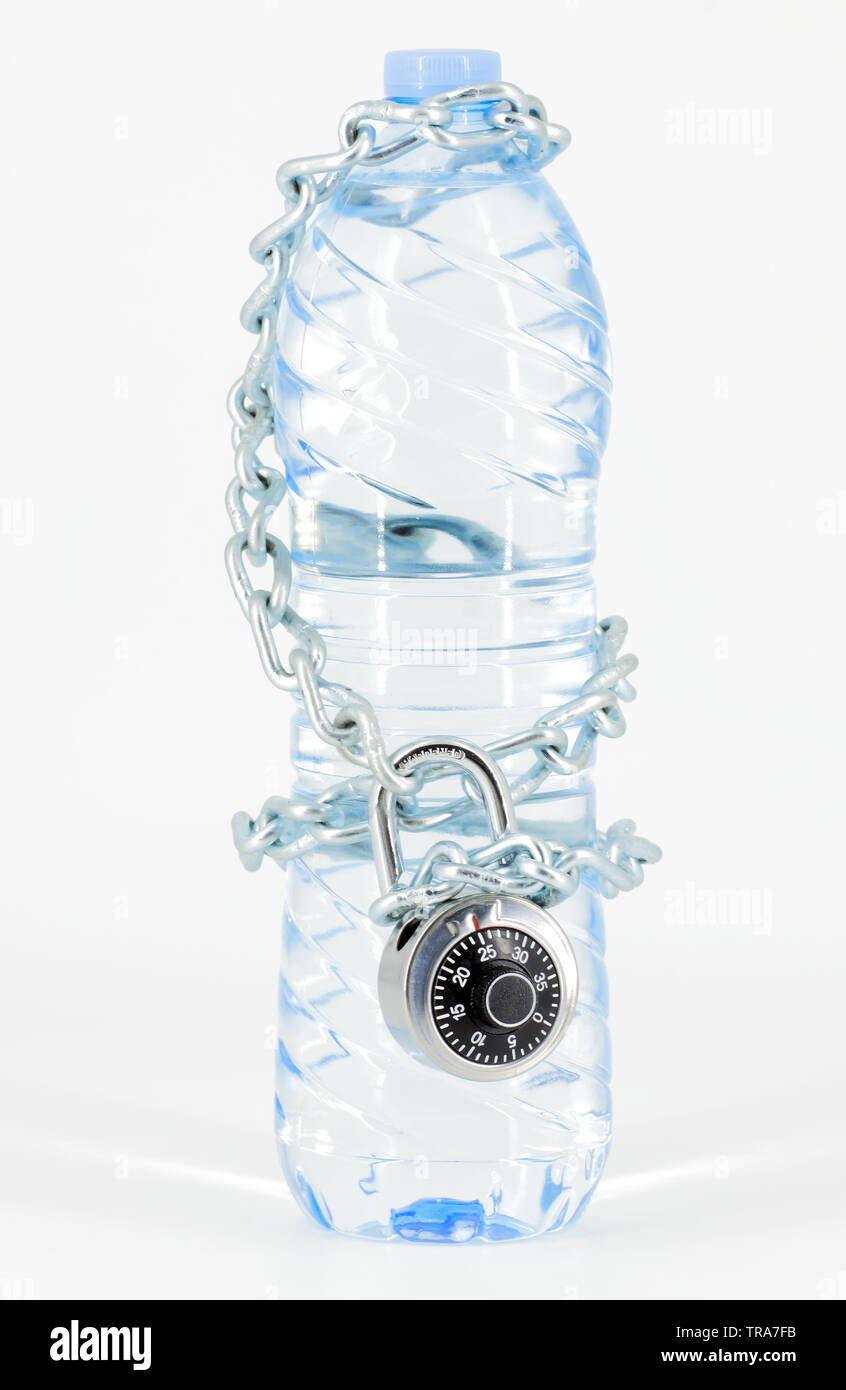 Bottle of mineral water locked with chain and padlock on white ...