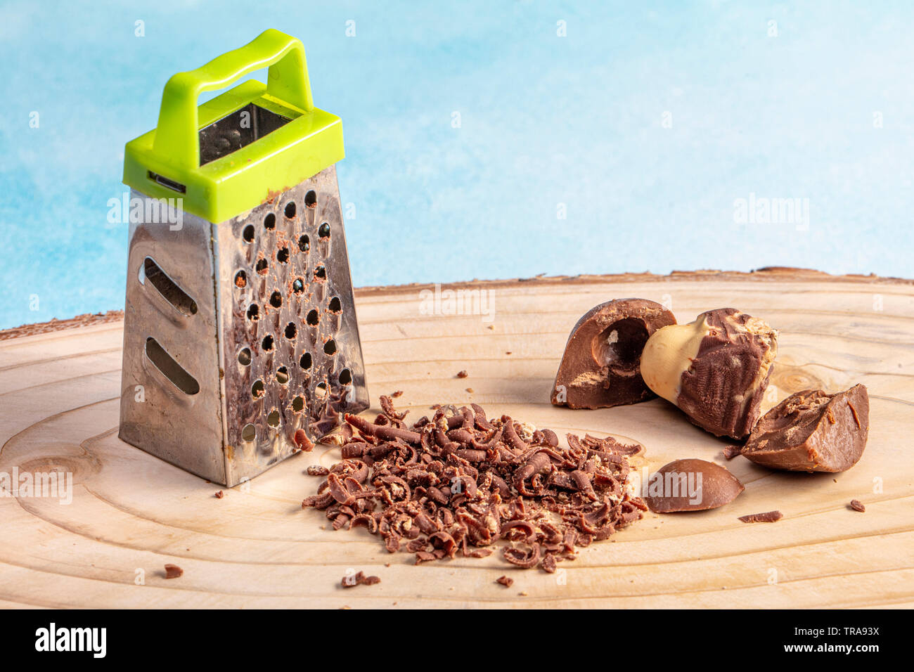 shredded chocolate pieces falling on a chocolate pile with nuts Stock ...