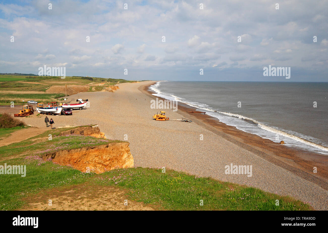 A view of the cliffs and the Norfolk Coast Path leading to the beach in ...