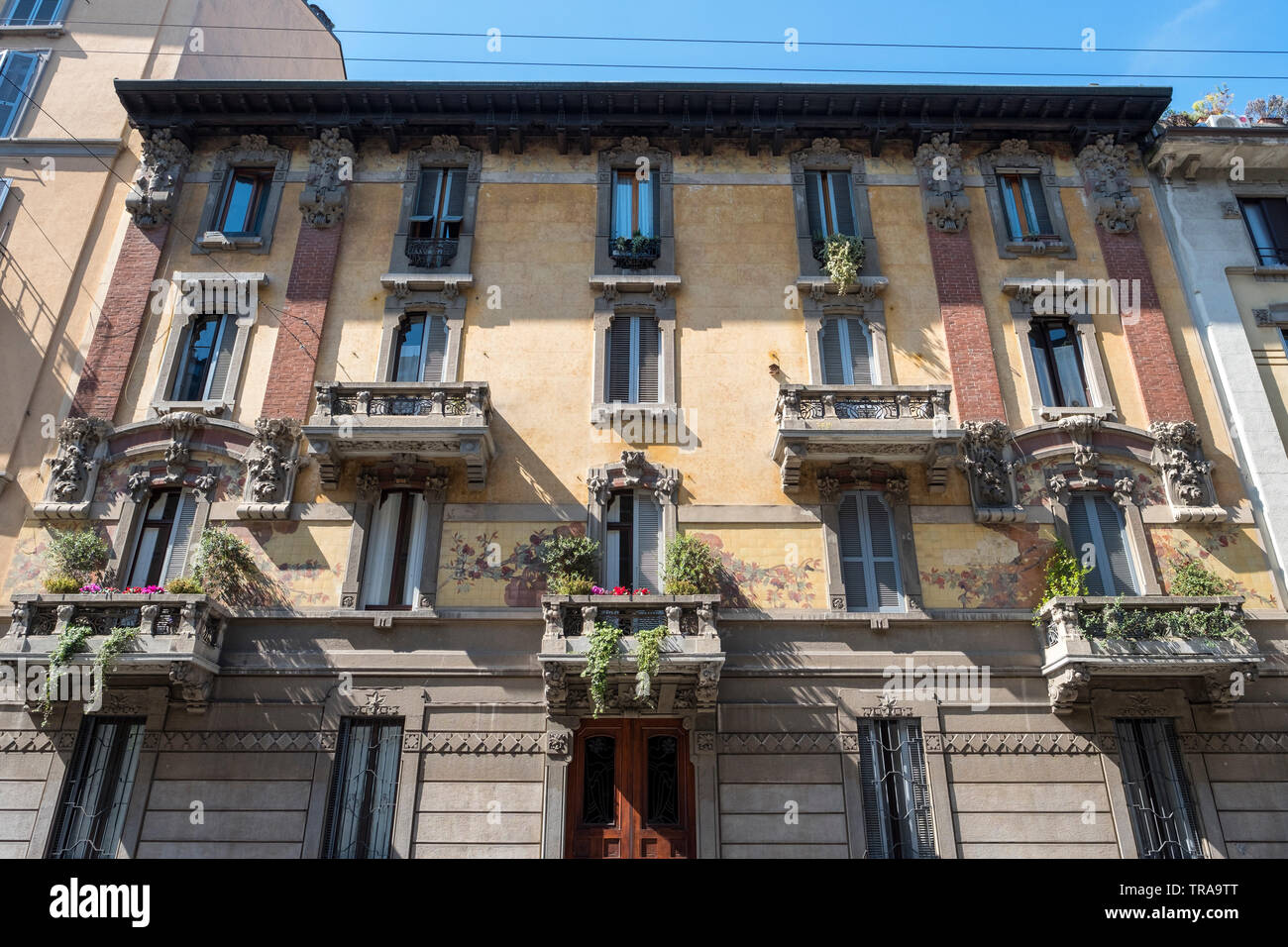 Milan, Lombardy, Italy: facade of an old typical residential building ...