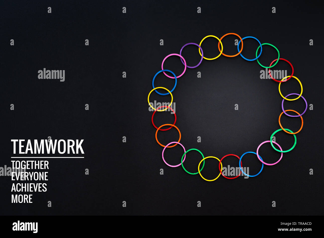 Teamwork concept. group of colorful rubber band on black background ...