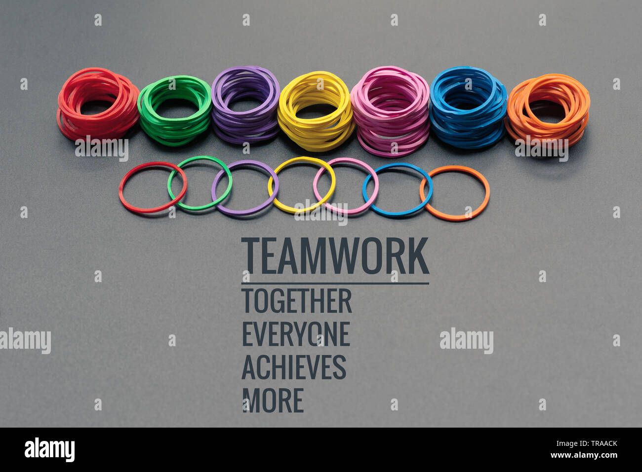 Teamwork concept. group of colorful rubber band on black background ...