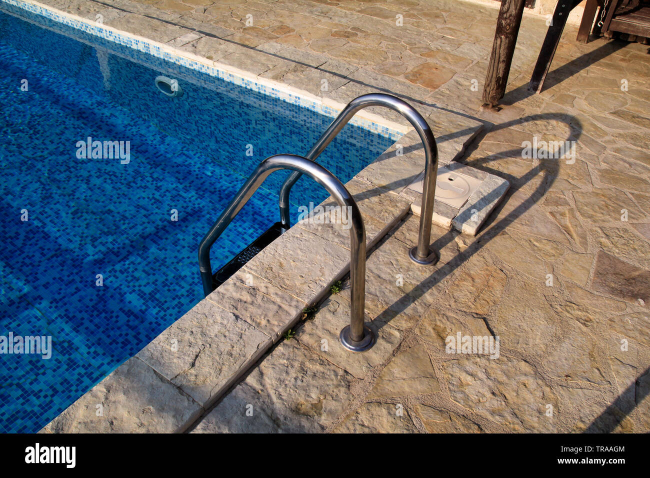 Handrail on pool. Swimming pool with stair at tropical resort. Pool ...