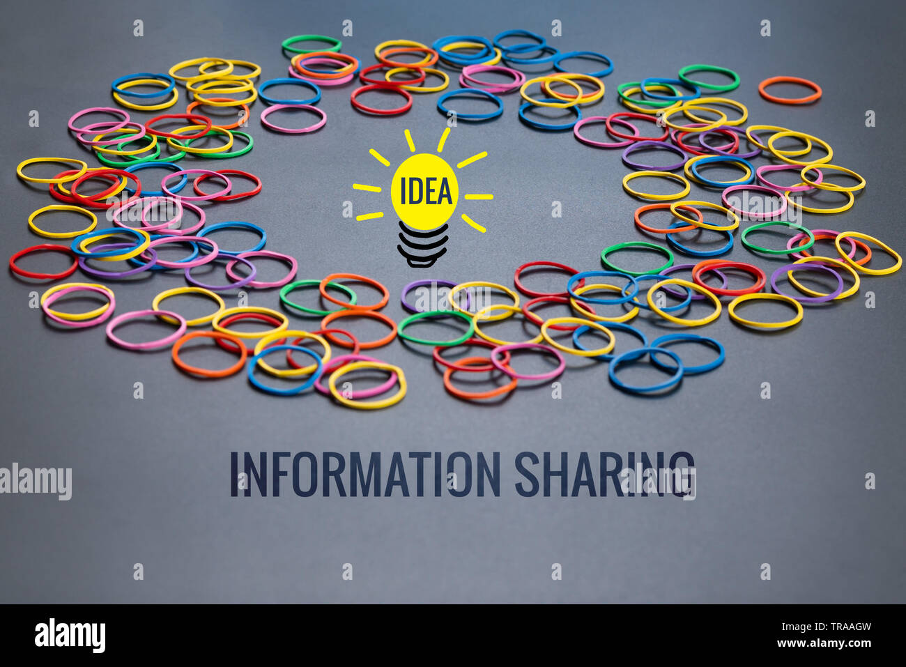 Information sharing concept, colorful rubber band with word Information ...