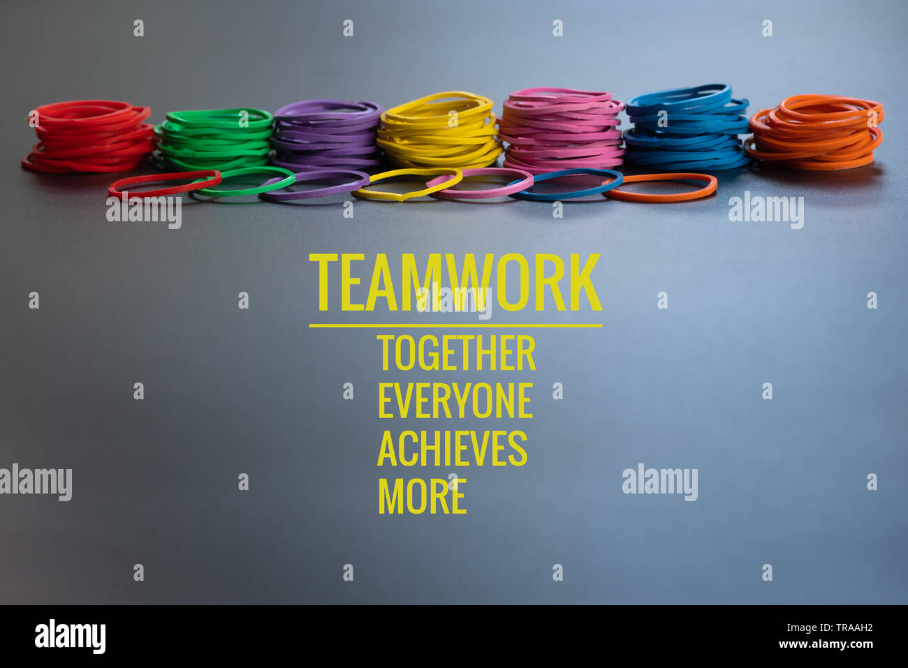 Teamwork concept. group of colorful rubber band on black background ...