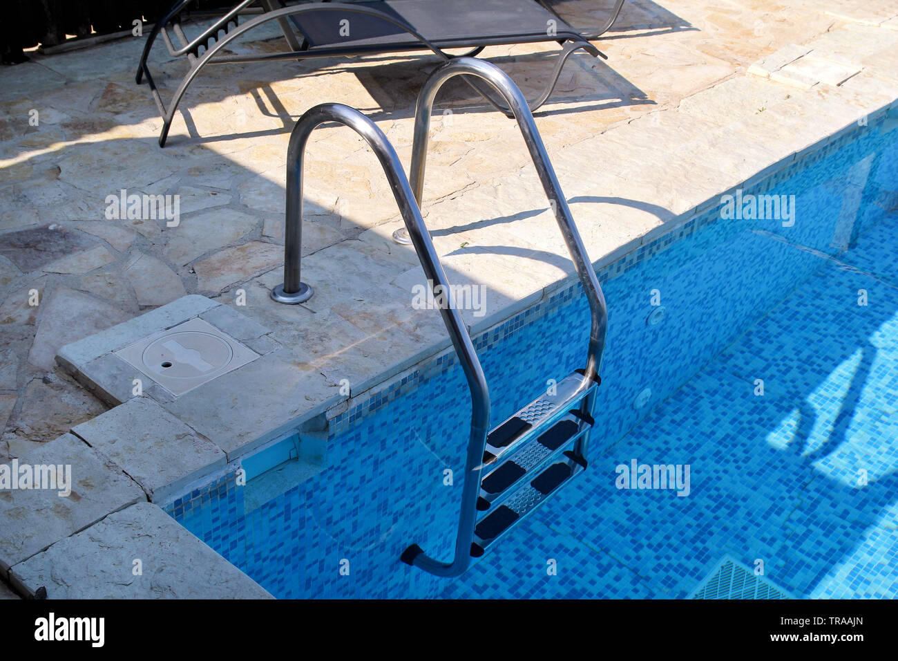 Handrail on pool. Swimming pool with stair at tropical resort. Pool ...