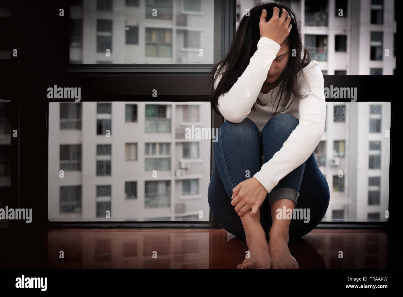 depressed women sitting near window, alone, sadness, emotional concept ...