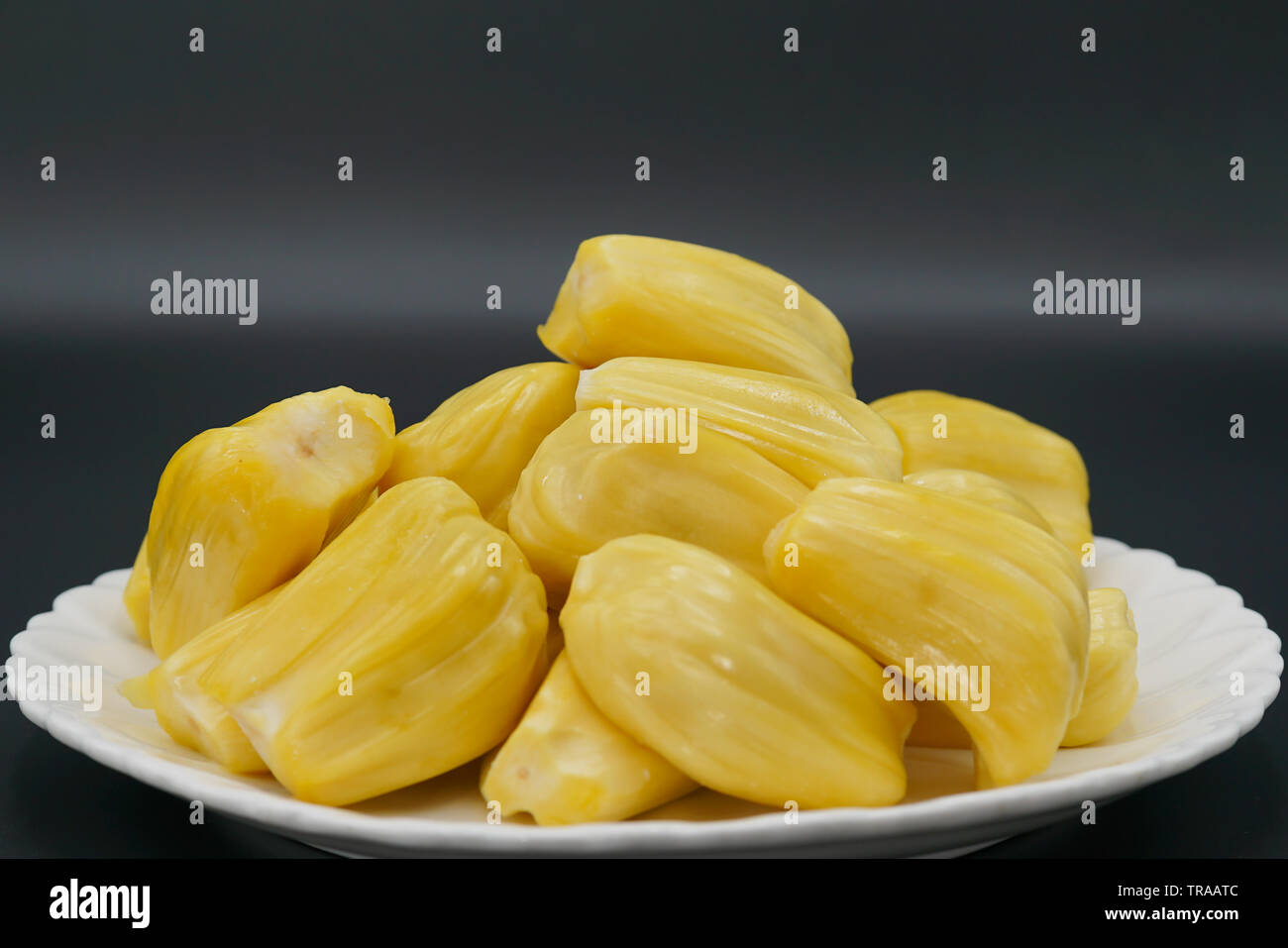 Fresh jackfruit slices on a white plate. sweet yellow jackfruit ripe ...