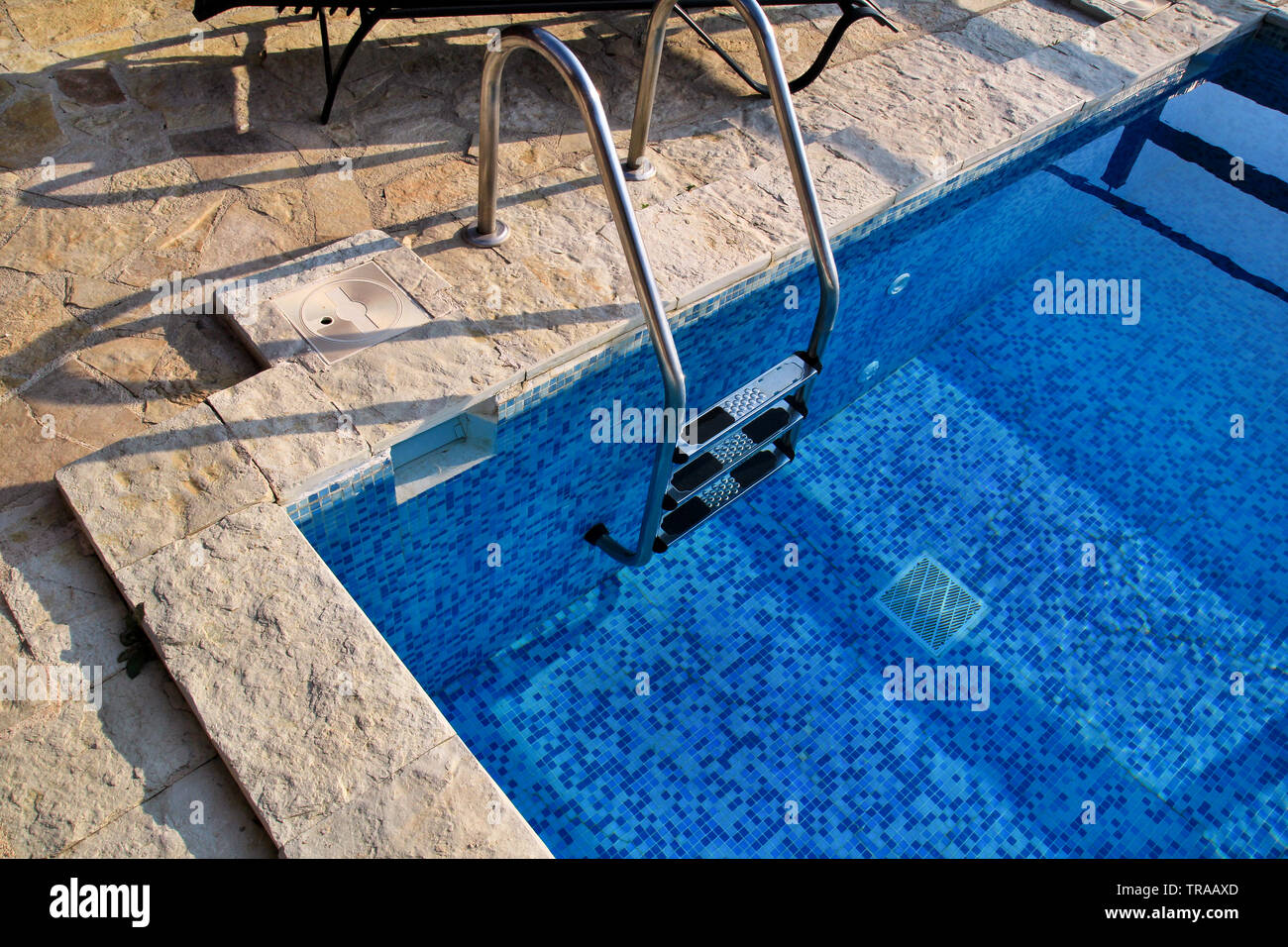 Handrail on pool. Swimming pool with stair at tropical resort. Pool ...