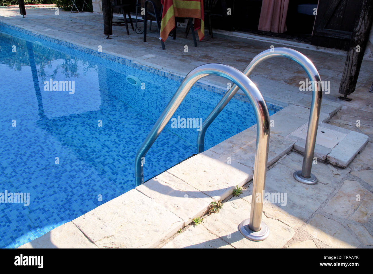 Handrail on pool. Swimming pool with stair at tropical resort. Pool ...