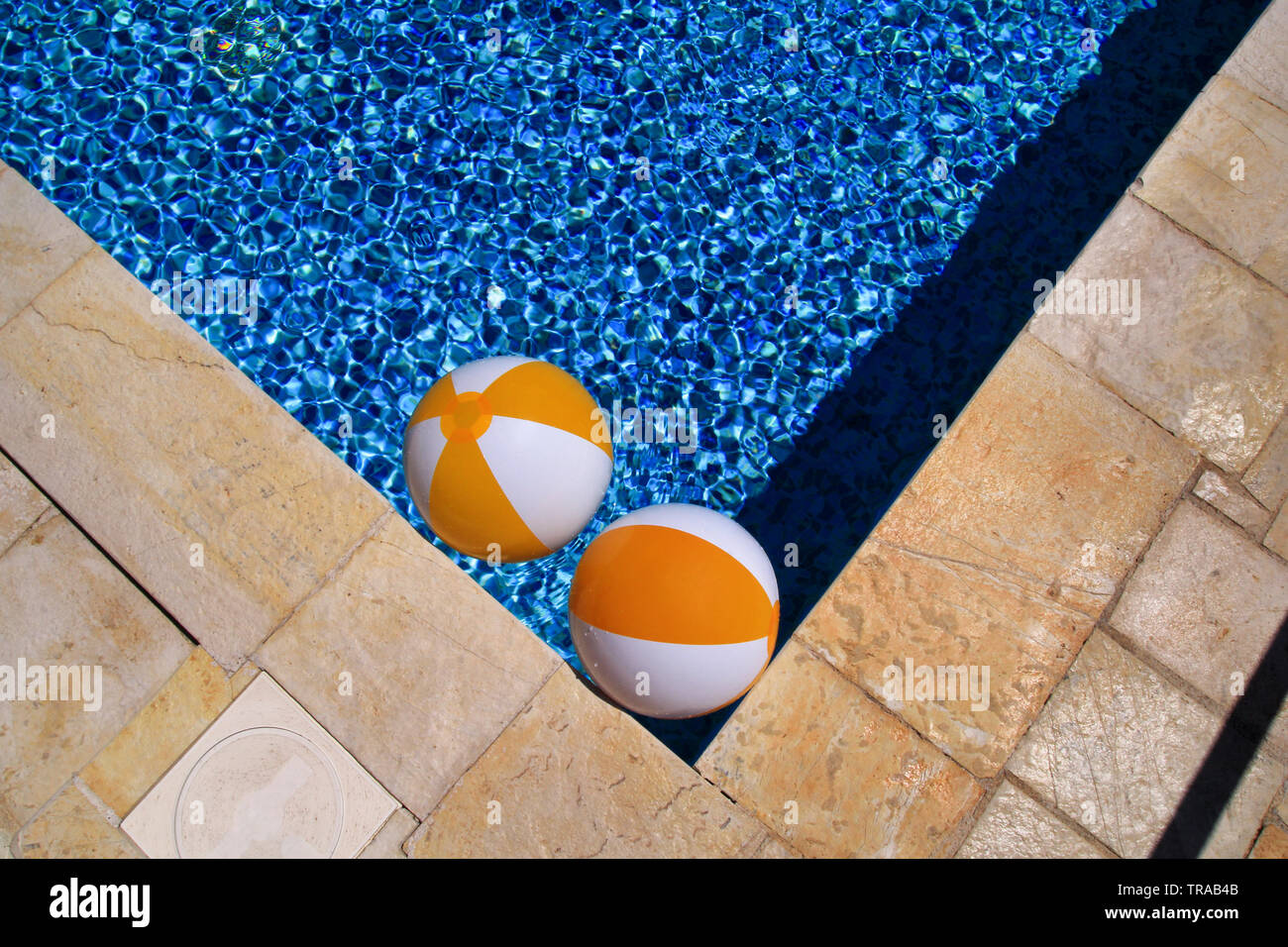 Two rubber air yellow white inflatable balls and toy for swimming pool ...