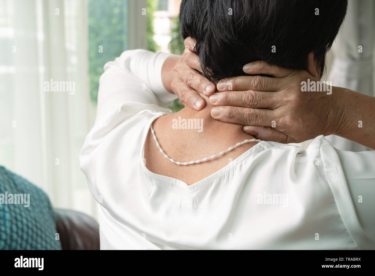old woman suffering from neck pain, closeup, health problem concept ...