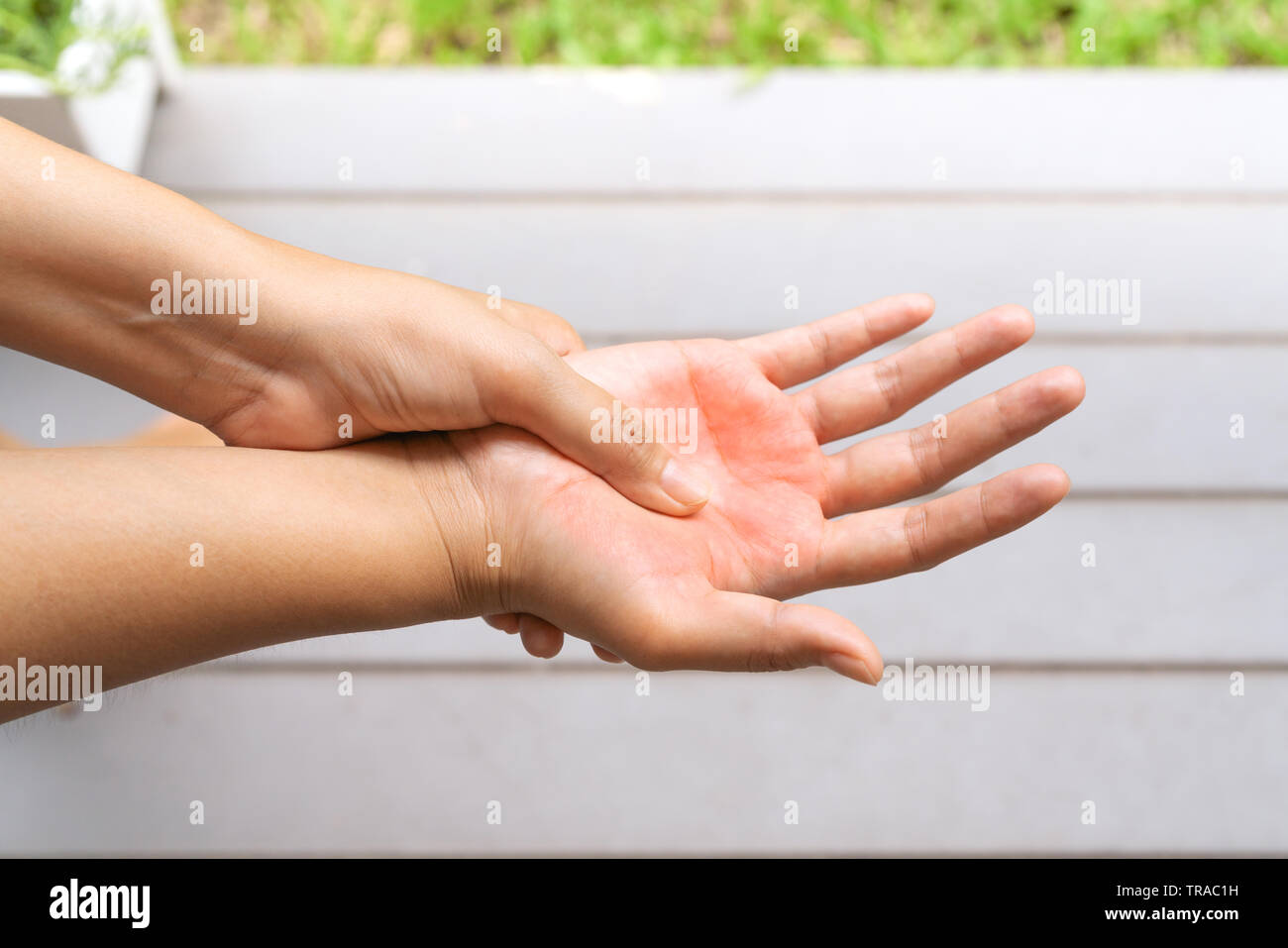 woman's wrist arm pain. office syndrome healthcare and medicine concept ...