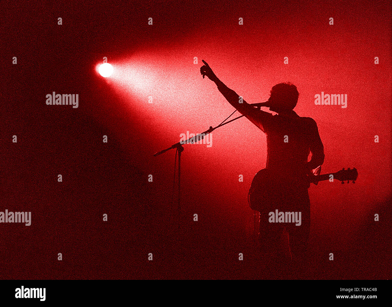 Amazing silhouette of a professional guitarist bandleader singer on ...