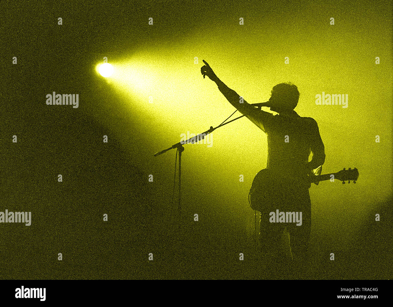 Amazing silhouette of a professional guitarist bandleader singer on ...