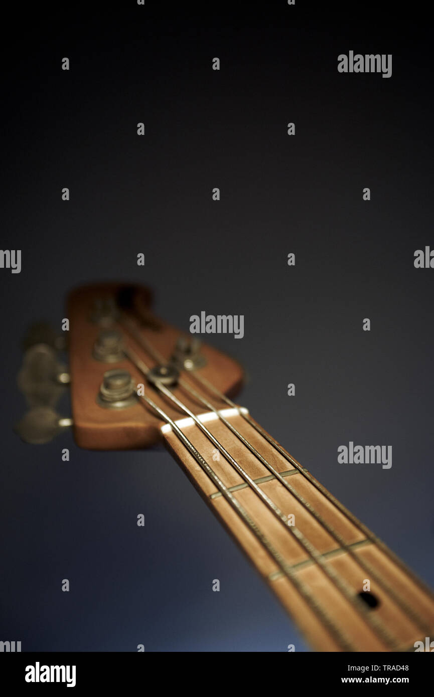 Close up of an electric 4 string bass guitar in a studio Stock Photo ...