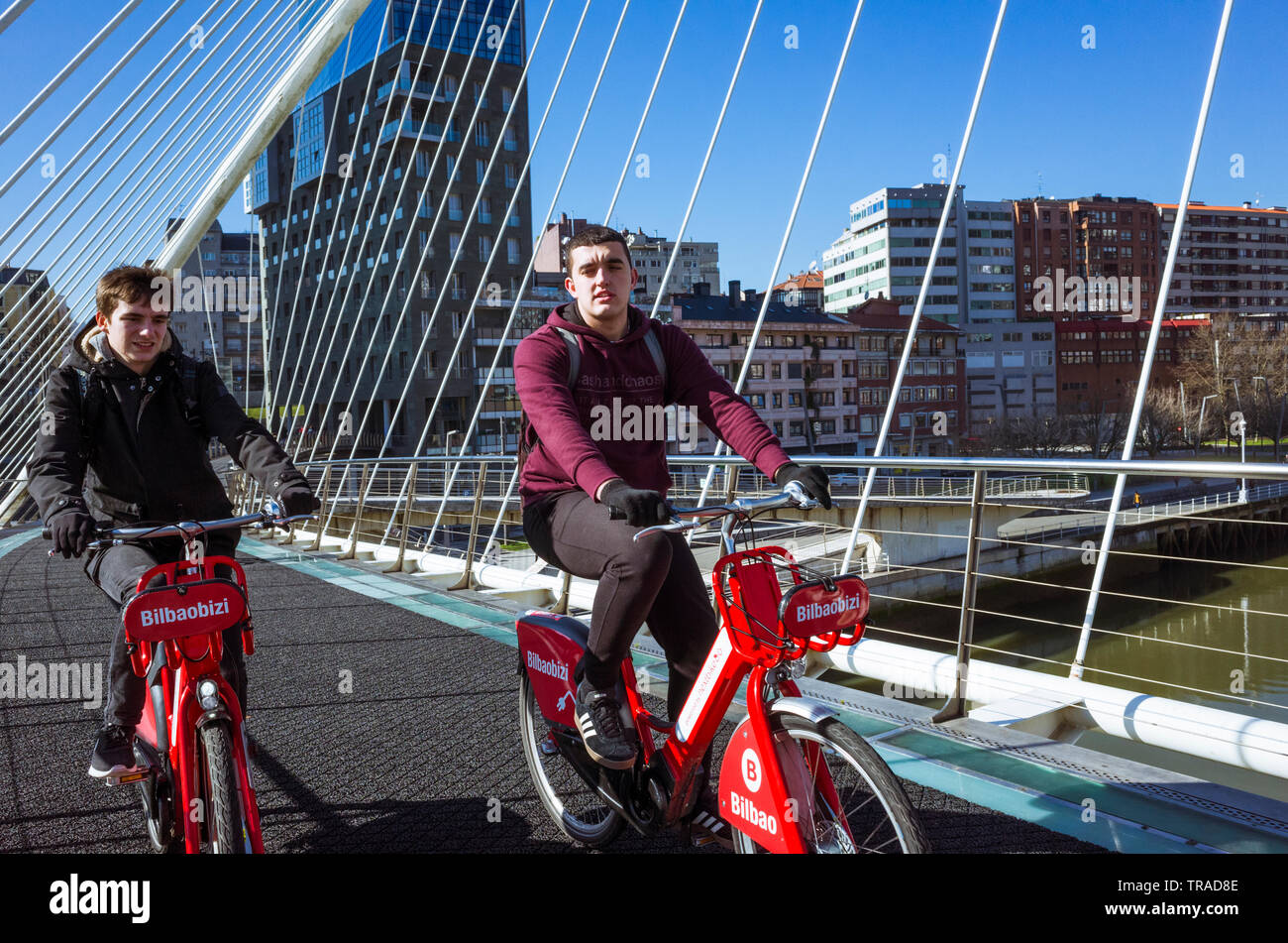 Bilbao, Biscay, Basque Country, Spain : Two young men cycle on the ...