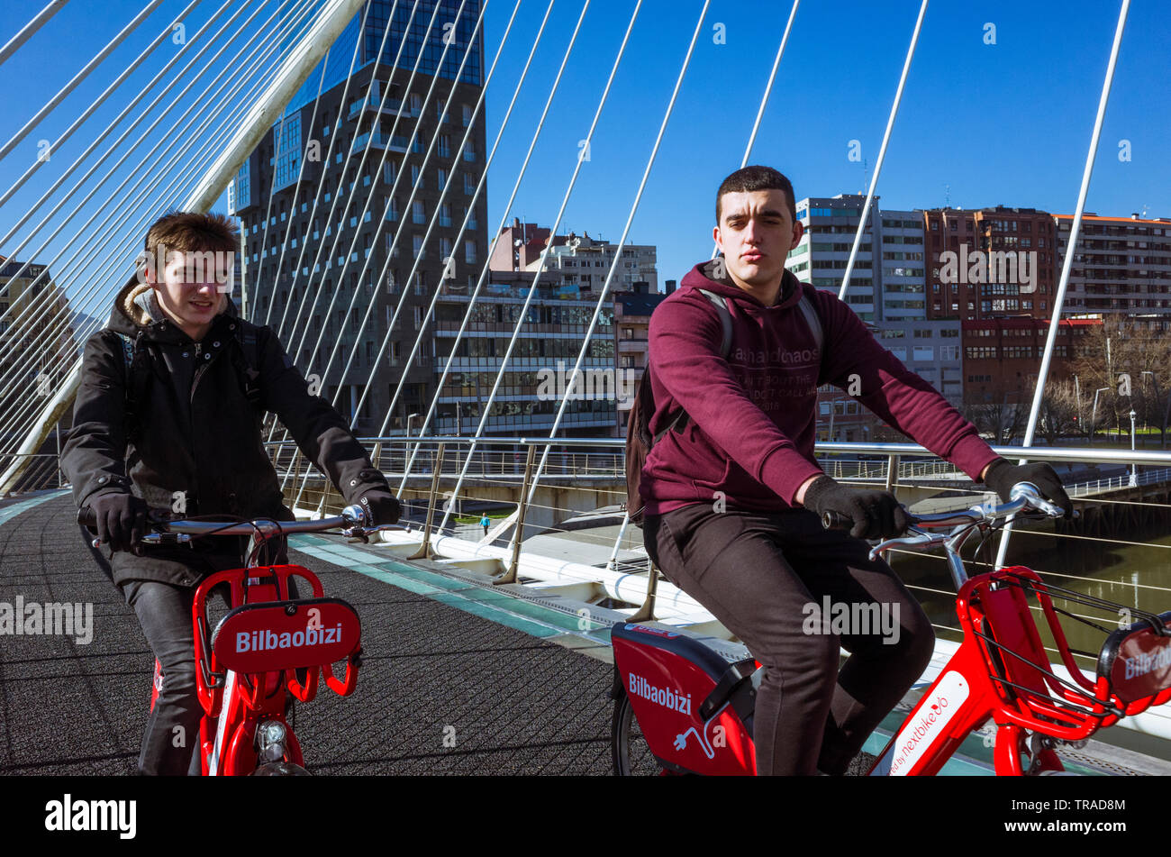 Bilbao, Biscay, Basque Country, Spain : Two young men cycle on the ...
