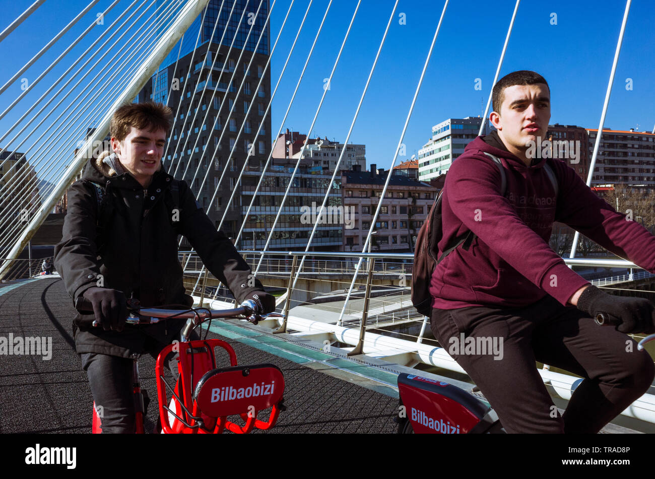 Bilbao, Biscay, Basque Country, Spain : Two young men cycle on the ...