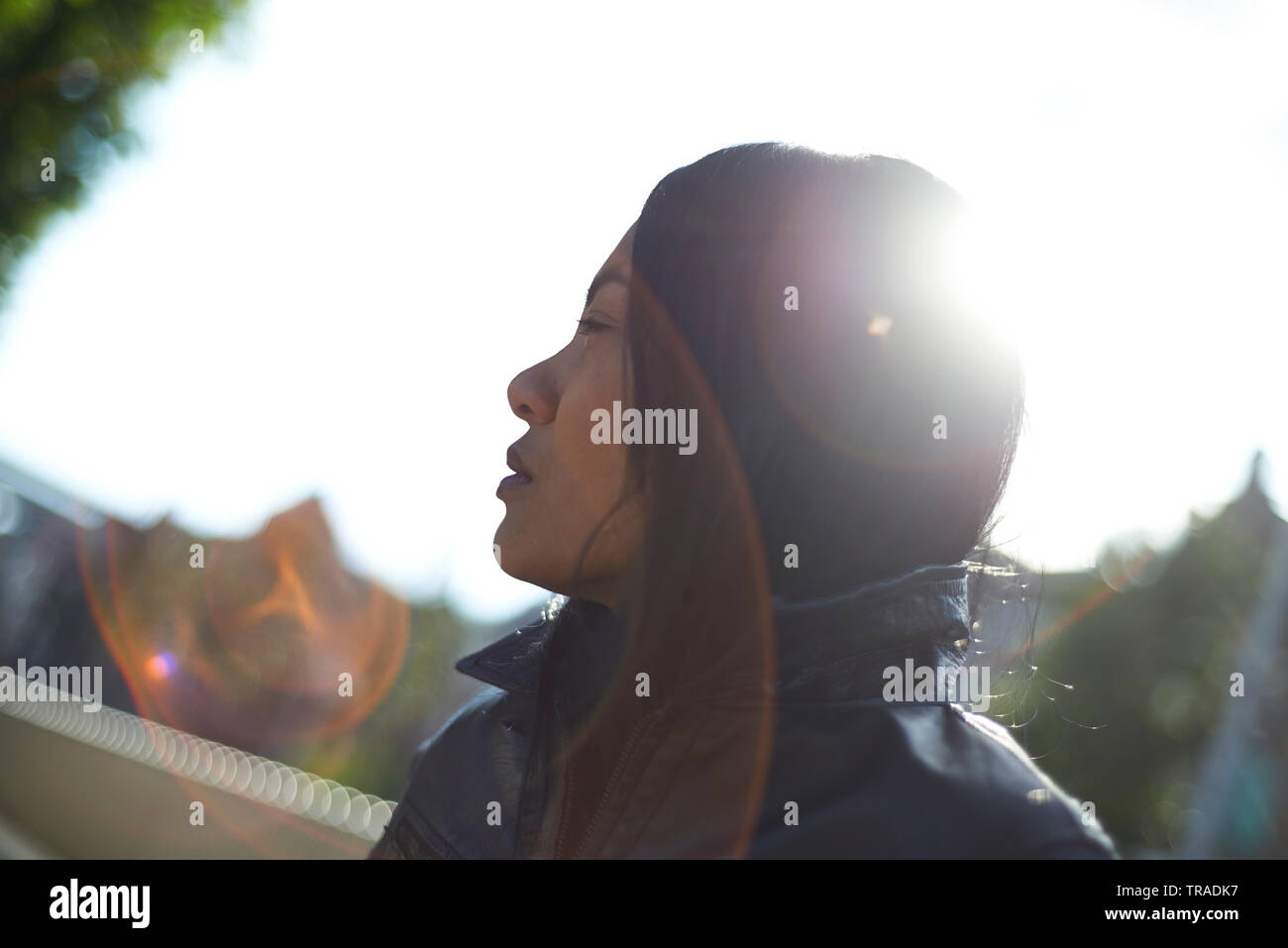 Asian tourist enjoying smoking a spliff with marijuana in summer ...