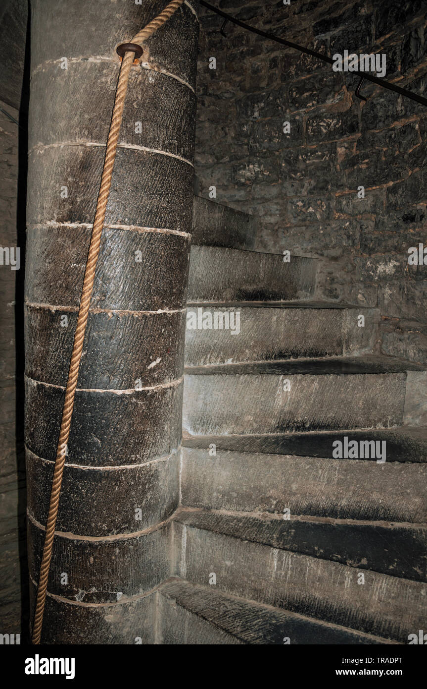 Stone stairs inside tower of the Gravensteen Castle at Ghent. City with ...