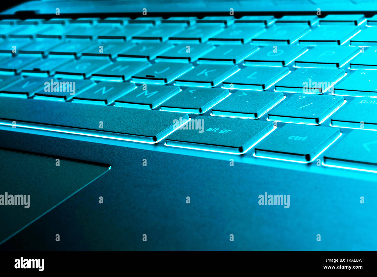 Closeup of a modern silver laptop computer keyboard. Laptop keyboard ...