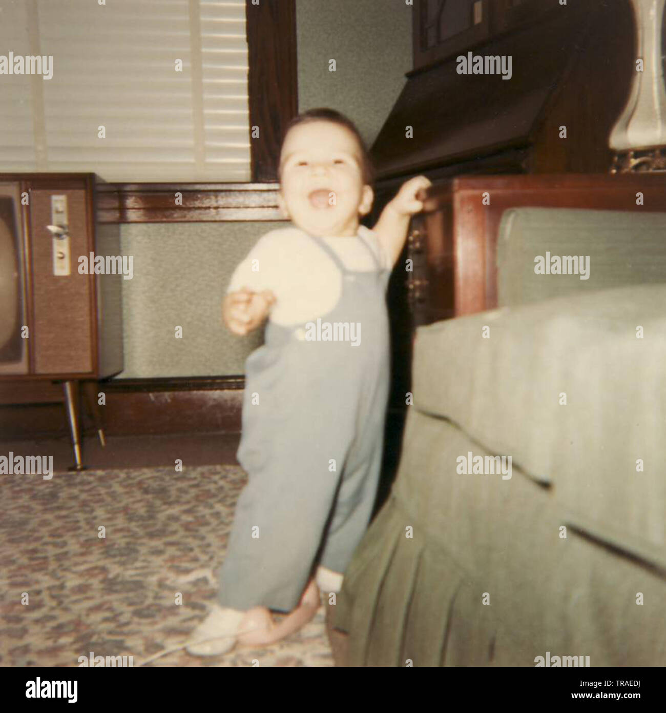 A vintage photo of an eight month old baby boy in 1965, wearing ...