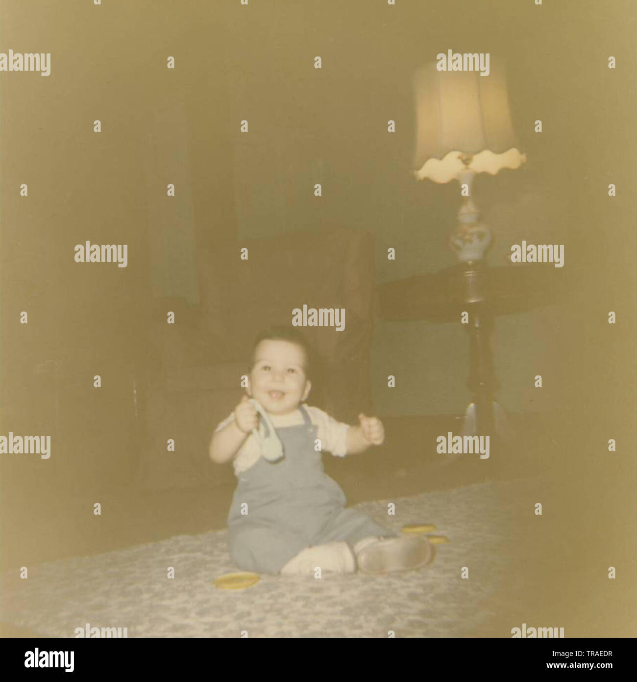 A vintage photo of an eight month old baby boy in 1965, wearing ...